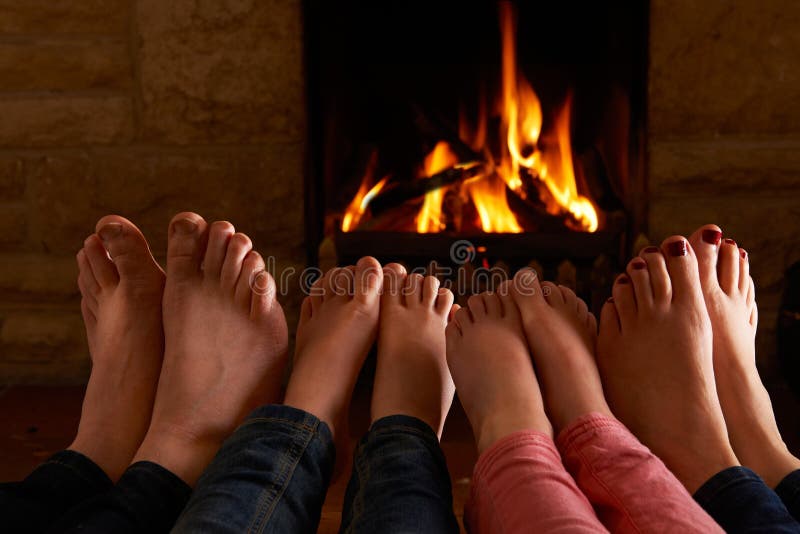 Family Warming Feet by Fire Stock Image - Image of people, fuel: 63545745