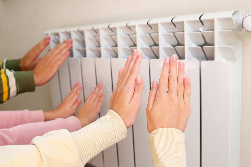 The Family Warms Their Hands Near the Radiator Stock Image - Image of ...