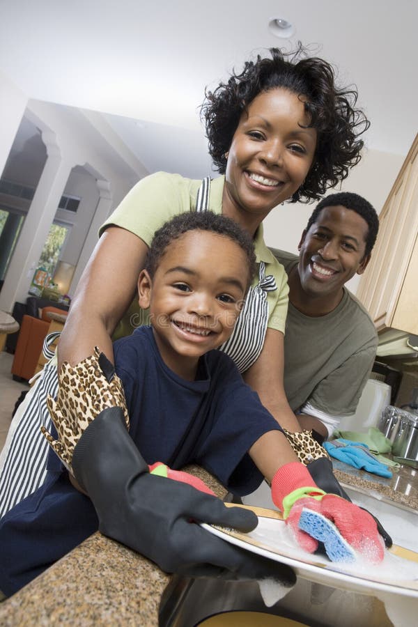 Family Washing Dishes at Kitchen Sink Stock Image - Image of father ...