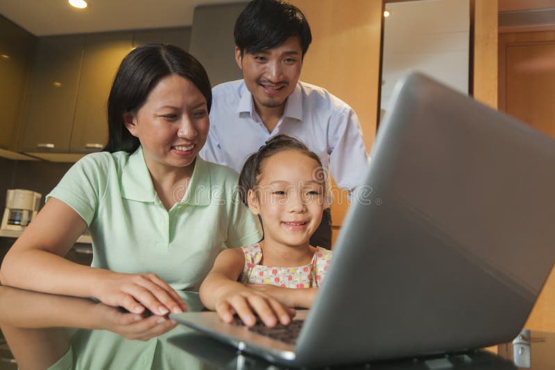Family Watching Movie on the Laptop Stock Image - Image of domestic ...