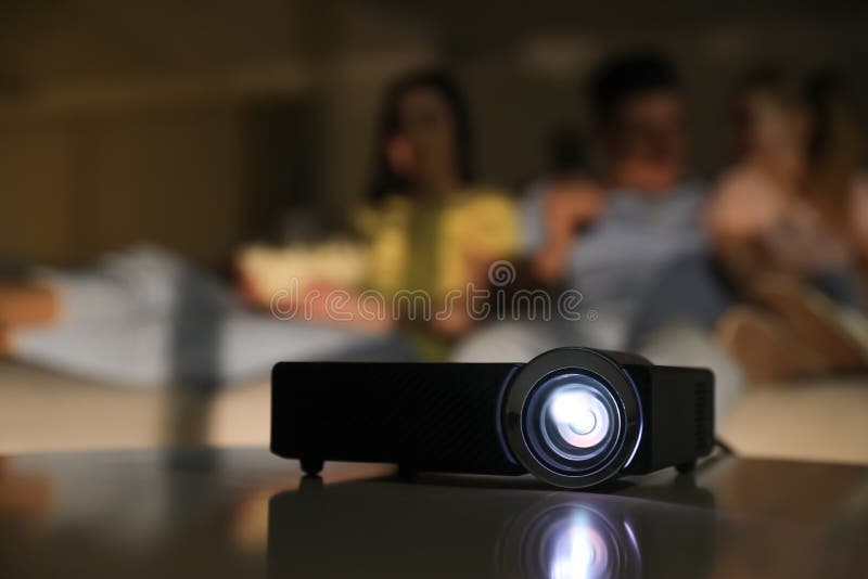 Family Watching Movie at Night, Focus on Video Projector Stock Photo ...