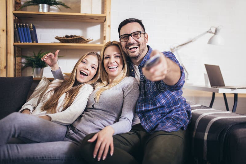 Family Watching TV Together at Home and Having Fun Together Stock Image ...