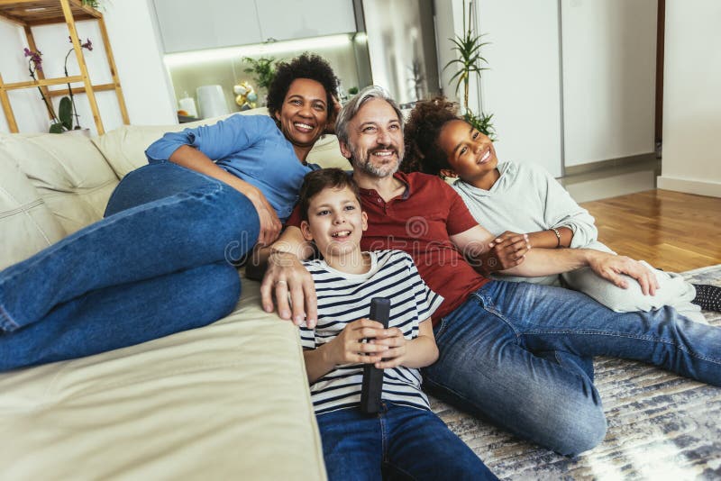 Family Watching TV Together at Home and Having Fun Together Stock Image ...