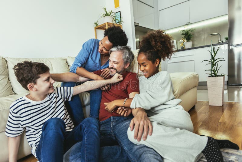 Family Watching TV Together at Home and Having Fun Together Stock Photo ...