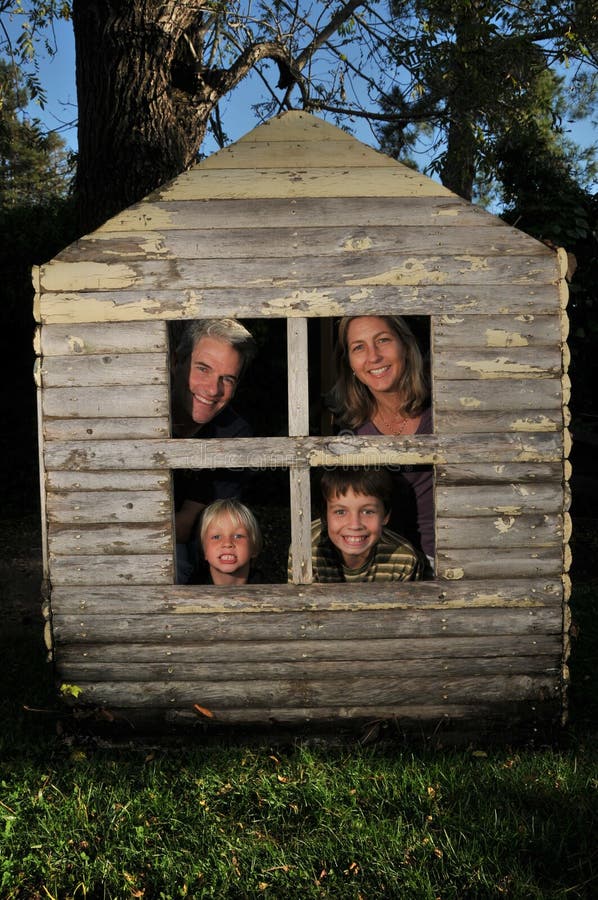 Family in the Windows of a Very Small House Stock Photo - Image of fake ...