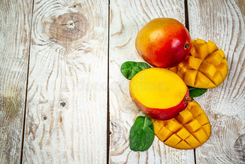 Famous Alphonso Mango Slices in a Wooden Box Over Wood Background, Top ...