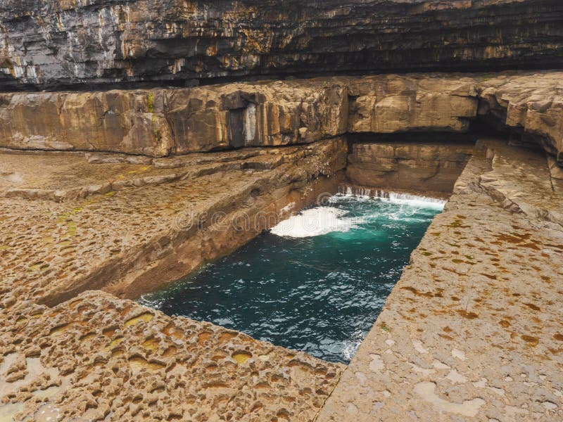 The Wormhole at the Cliffs of Inishmore, Aran Islands in Ireland Stock ...