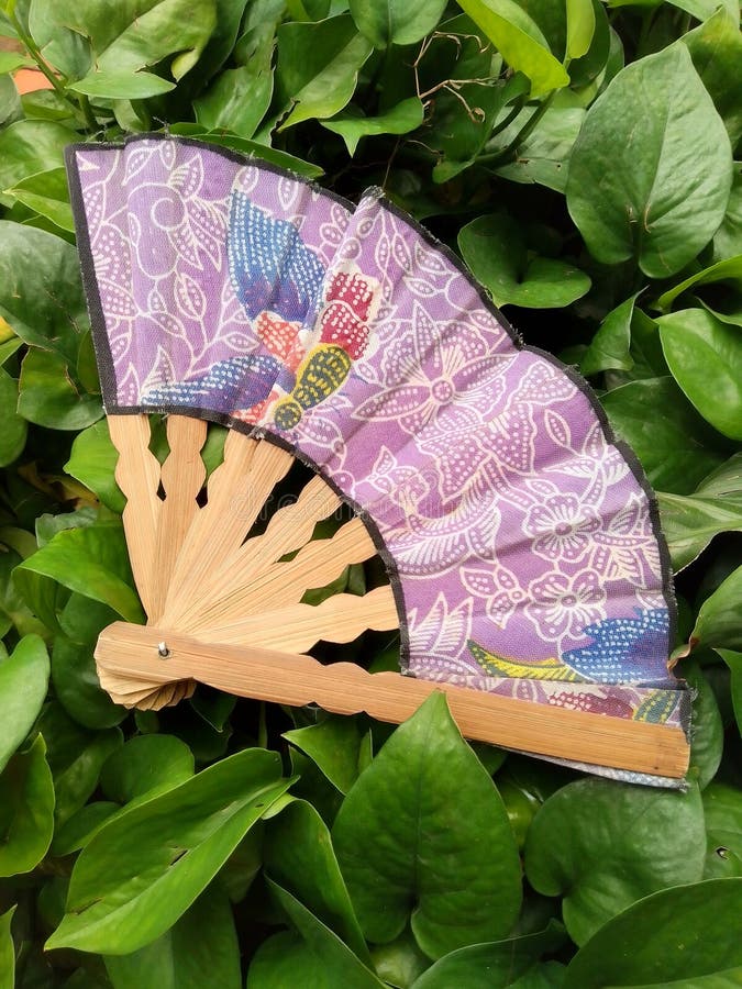 Fan Made of Purple Batik Cloth on Leaves Stock Image - Image of leaves ...