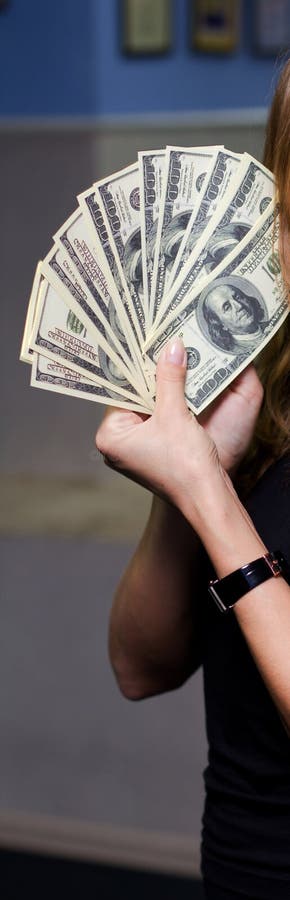A Fan of Money in the Hands of a Woman Stock Photo - Image of person ...