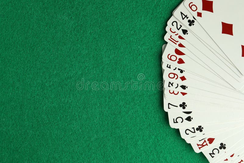 Fan of Playing Cards on Green Table, Top View. Space for Text Stock ...