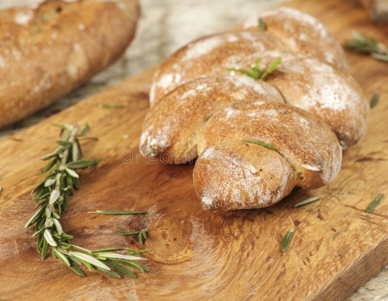 Fancy Bread with Herbs and a Cutting Board on a Granite Counter Stock ...
