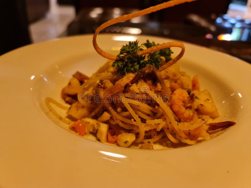Fancy Spaghetti with Shrimp, Parmesan and Basil. Girl`s Hands Wind ...