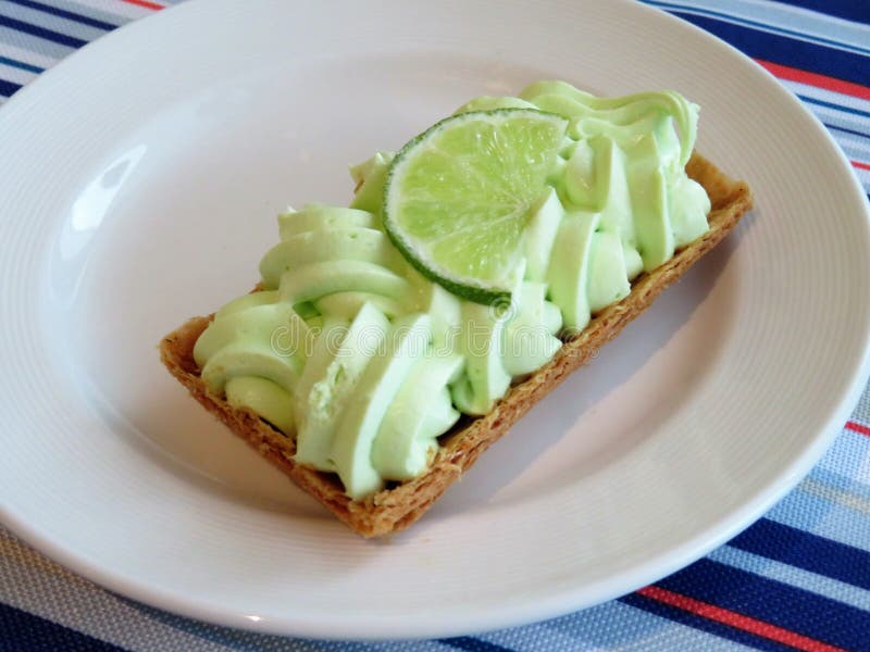 Fancy Key Lime Pie Dessert with a Slice of Lime Stock Image - Image of ...