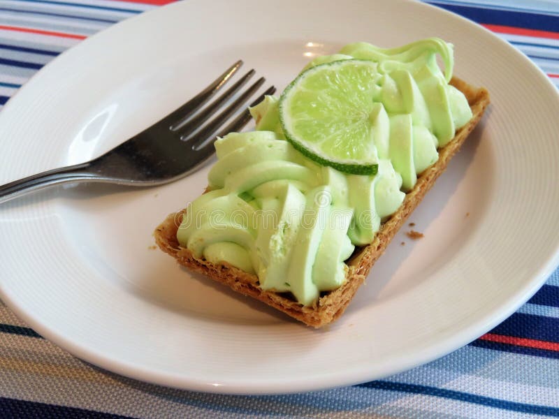 Fancy Key Lime Pie Dessert with a Slice of Lime Stock Image - Image of ...