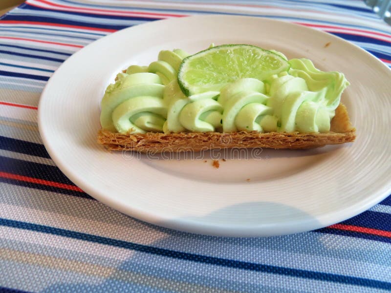 Fancy Key Lime Pie Dessert with a Slice of Lime Stock Image - Image of ...