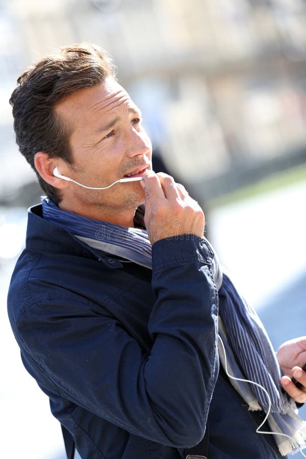 Fancy Man Talking on the Phone with Headphones Stock Photo - Image of ...
