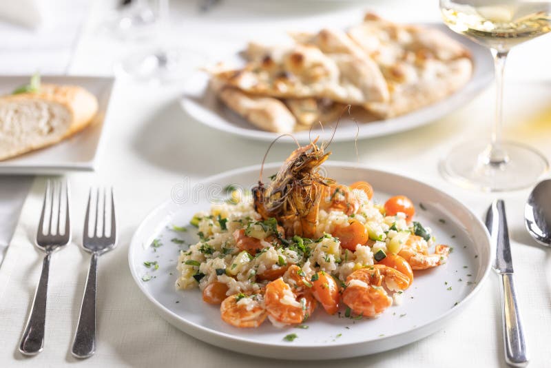 Fancy Serving of Prawns and Courgette Risotto on a Table in the ...