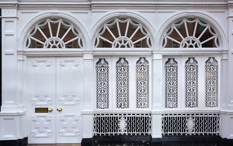 Fanlight Windows and Ornate Grille on Old Office Building Stock Image ...