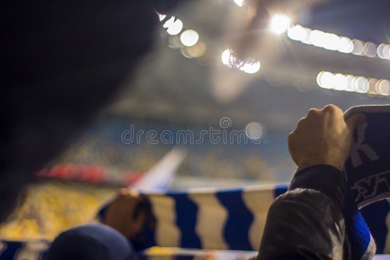 Fans in the Stadium Holding Flags of Their Football Team Stock Image ...