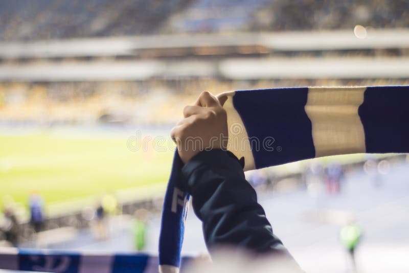 Fans in the Stadium Holding Flags of Their Football Team Editorial ...