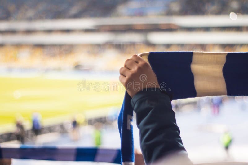 Fans in the Stadium Holding Flags of Their Football Team Stock Image ...