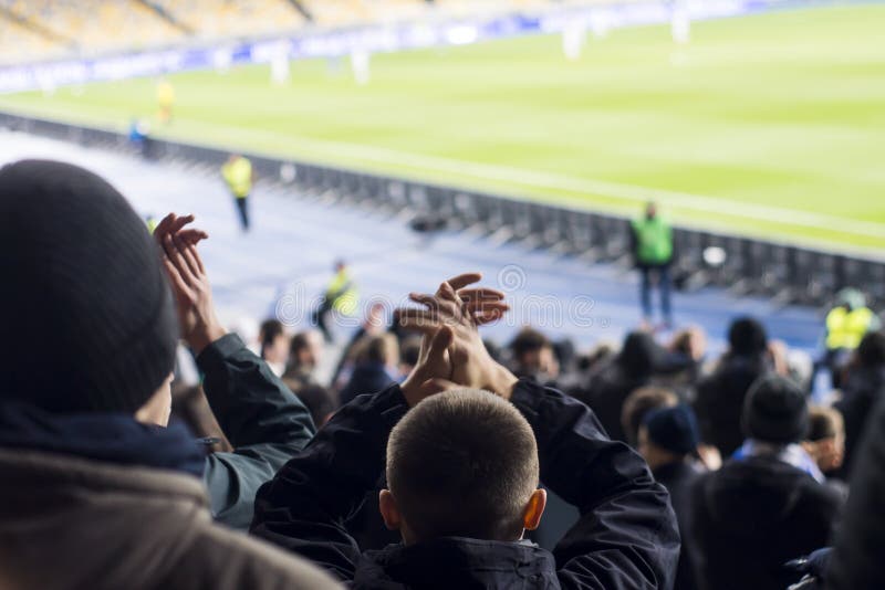 Fans in the Stadium Holding Flags of Their Football Team Editorial ...
