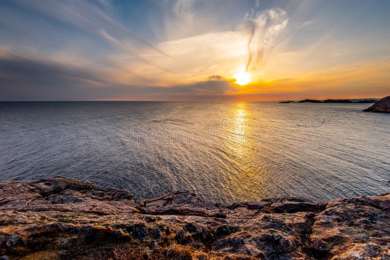 Fantastic, Cloudy Sunset Over the Sea Seen from a Cliff Stock Photo ...