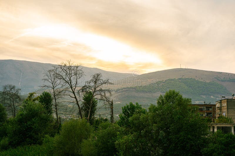 Fantastic Scene of Green Meadows and Forested Mountain Ranges in Sunny ...