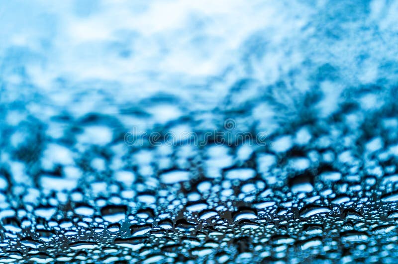 Fantastic View of Clear Big and Small Raindrops on a Glass on Blue ...