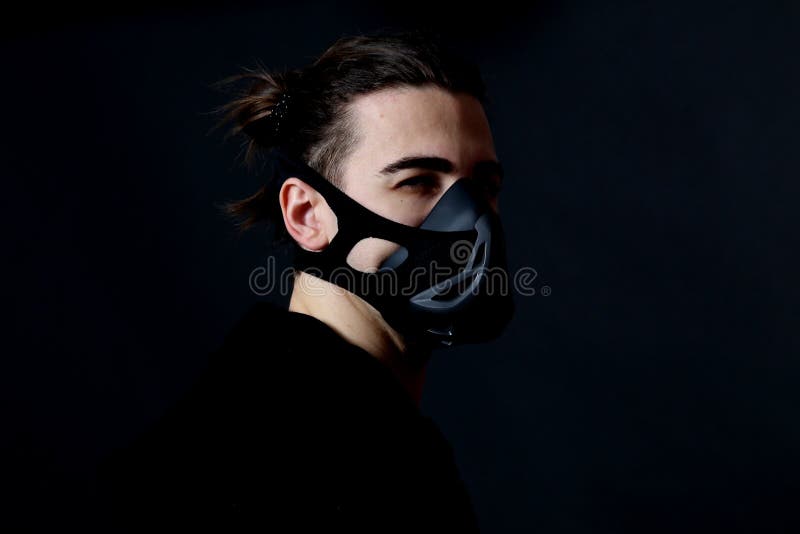 Young Male Model with Mask Posing in Studio. Fantasy, Halloween, Sci-Fi ...