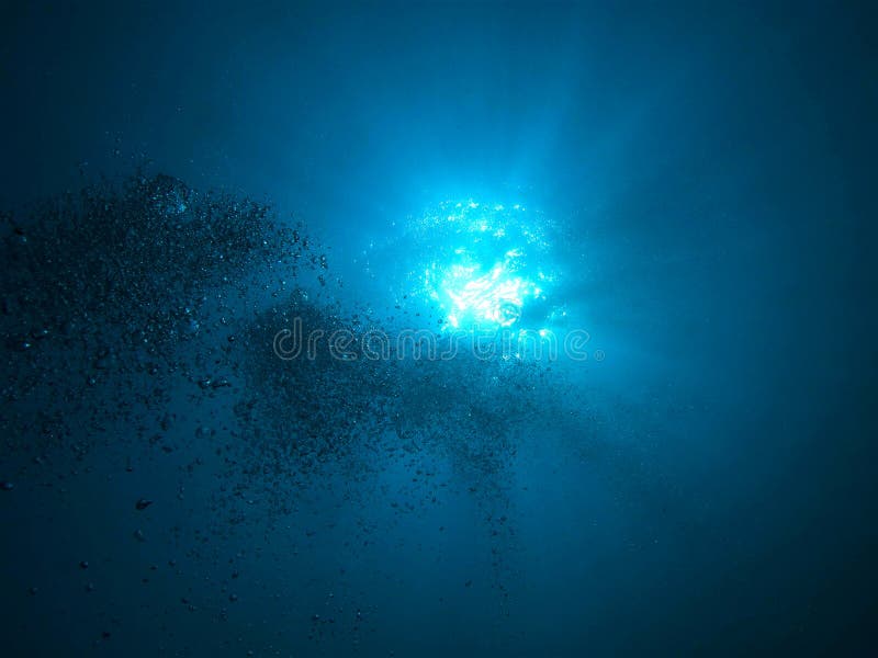 Fantasy Rays of Sunlight in the Deep Blue Ocean Stock Photo - Image of ...