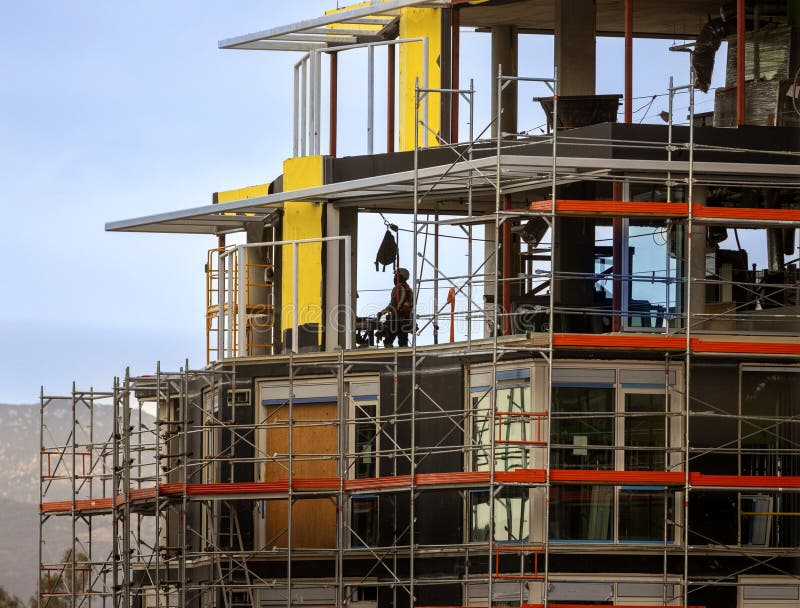 Far Shot of a Construction Worker Working in a Large Commercial ...