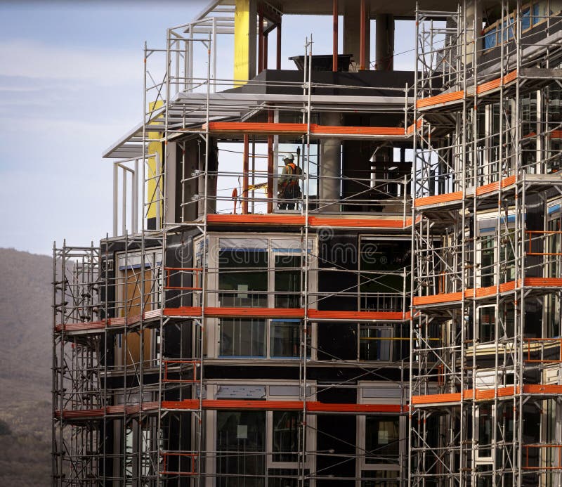 Far Shot of a Construction Worker Working in a Large Commercial ...