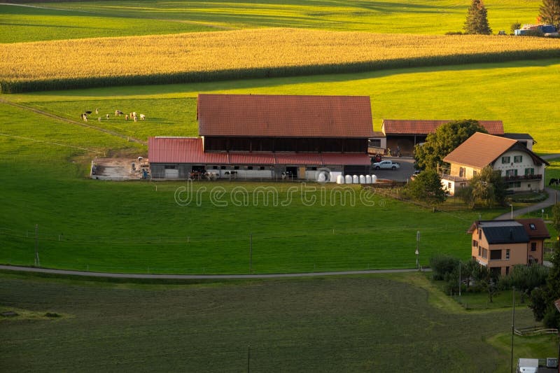 A Farm with a Barn and a House in the Background Stock Photo - Image of ...