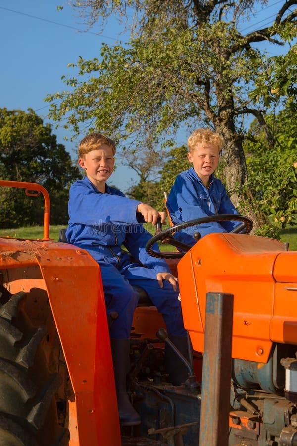 Farm Boys with tractor stock photo. Image of driving - 60732952