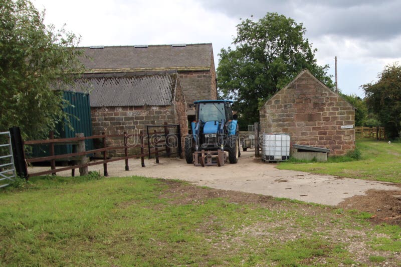 Farm Buildings with Tractor Stock Image - Image of tractor, trees: 98208797