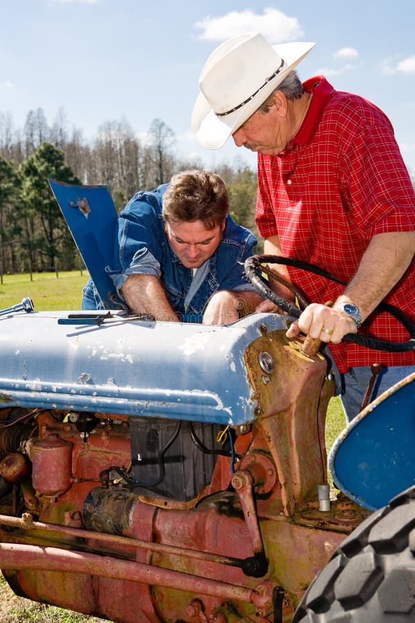 Farm Equipment Maintenance stock photo. Image of person - 4989880