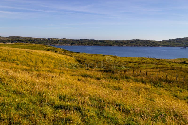 Farm Field, Bay and Mountains Stock Photo - Image of iron, sunset ...
