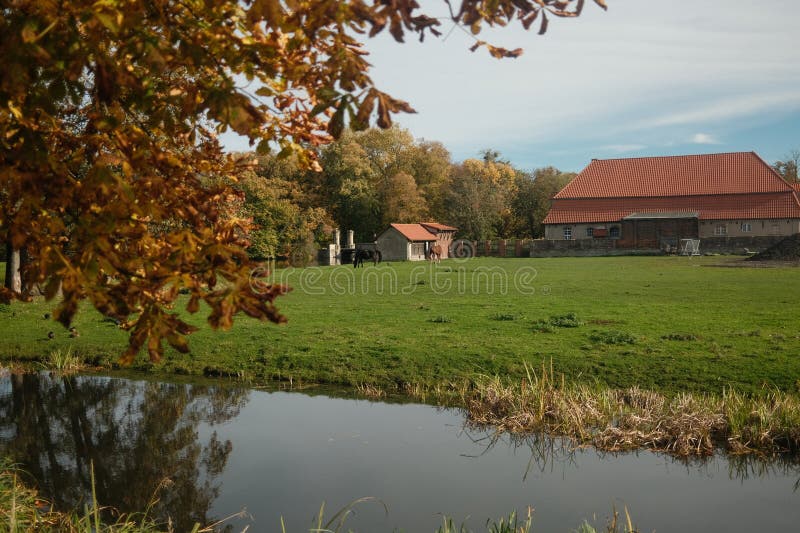 A Farm with a Red Barn and a Pond Stock Image - Image of country ...