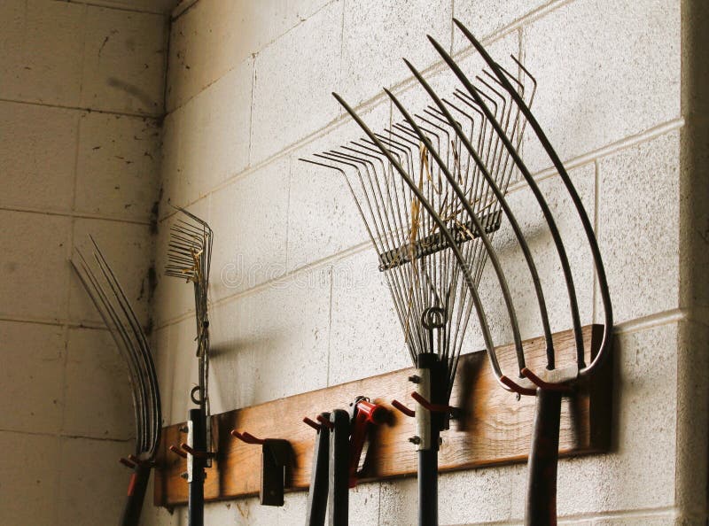 Farm Tools Hanging by the Barn Door Stock Image - Image of barn, hands ...