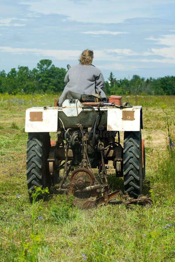 Man operating a tractor stock image. Image of farmer, wheels - 2742781