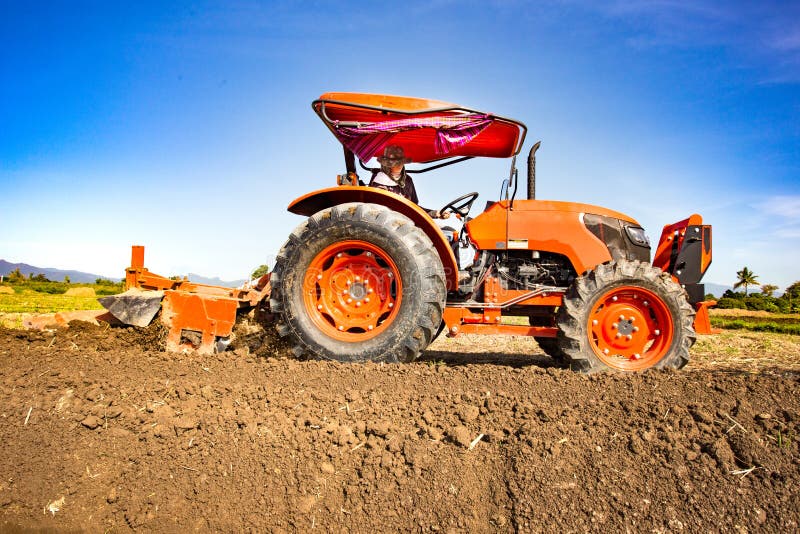 Farm Tractor Plowing Field stock image. Image of nonurban - 127944783