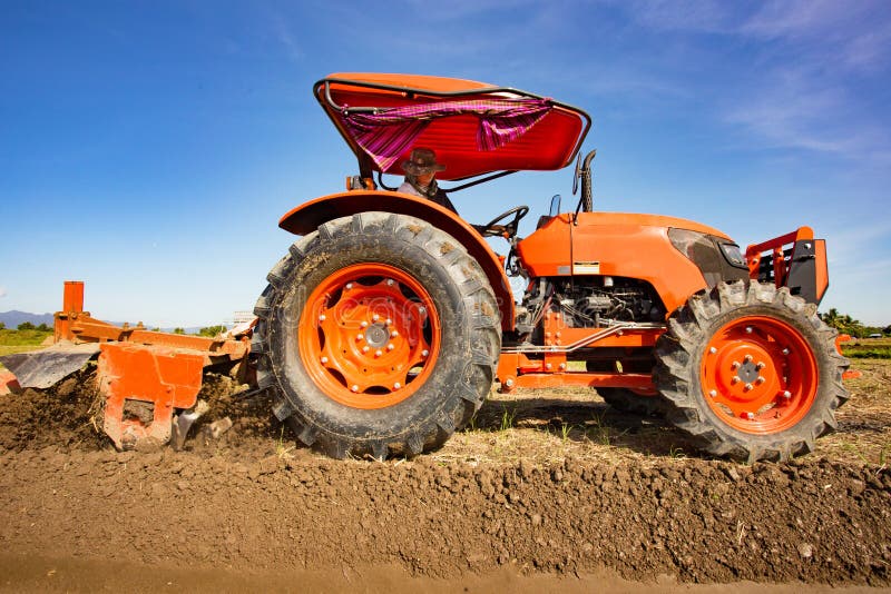 Farm Tractor Plowing Field stock image. Image of dirt - 127946933