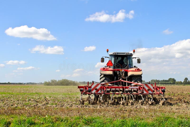 Farm Tractor Plowing the Land Stock Photo - Image of driving, copy ...
