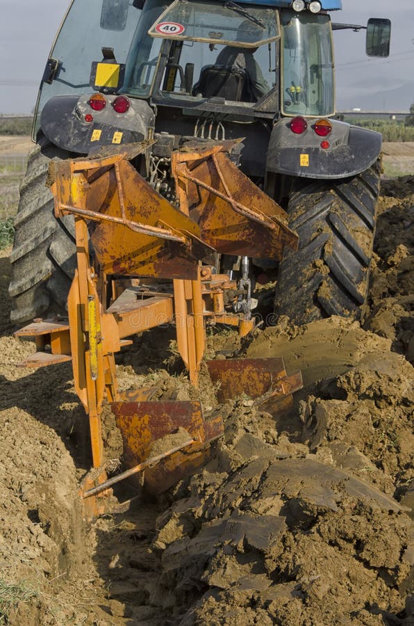 Farm Tractor that Plows the Ground Stock Photo - Image of plough, plots ...