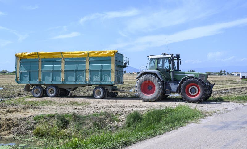 Farm Tractor with Trailer in the Field Stock Photo - Image of machinery ...