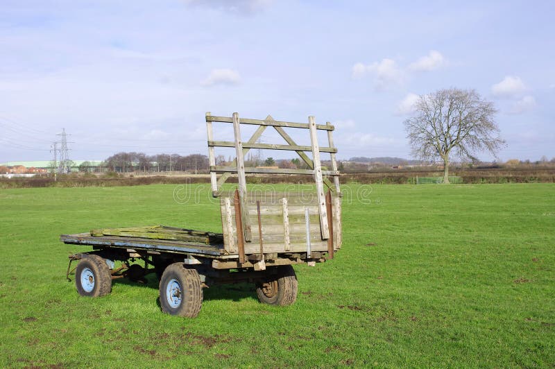 Farm Trailer Parked in Hay Barn Stock Photo - Image of bales, pile ...