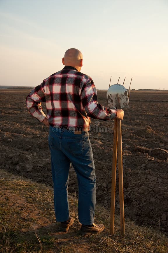 Farmer back view stock image. Image of jeans, holding - 25454239