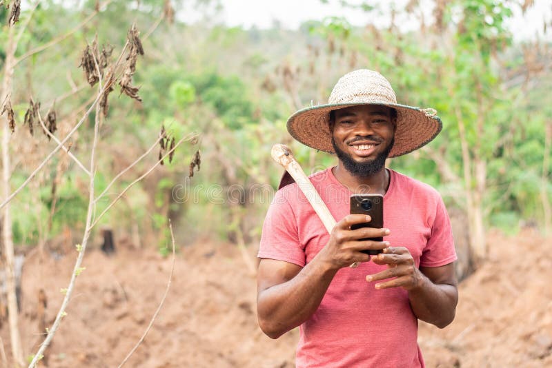 Farmer checking his phone stock image. Image of black - 254994195