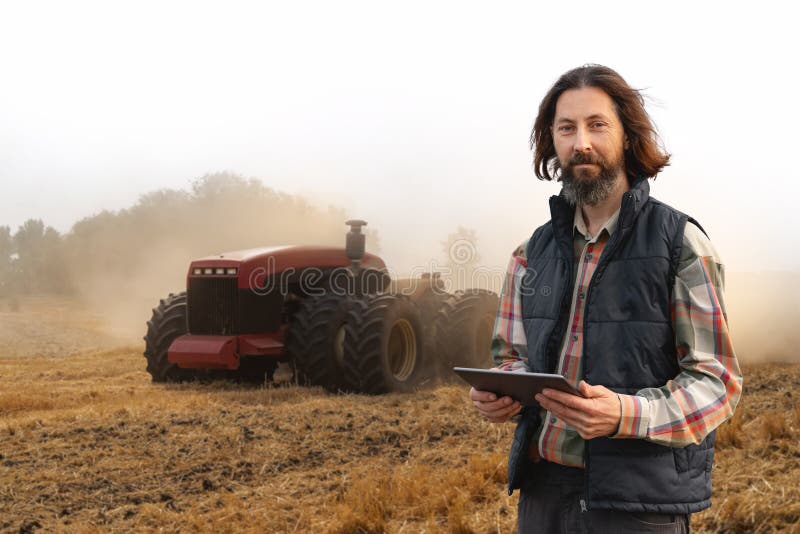 Farmer with Digital Tablet Controls an Autonomous Tractor Stock Image ...